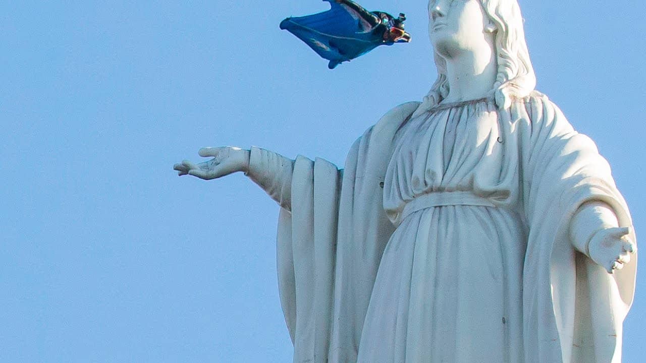 Virgin Flight: Wingsuiter Skims Statue in Santiago, Chile | TEEM